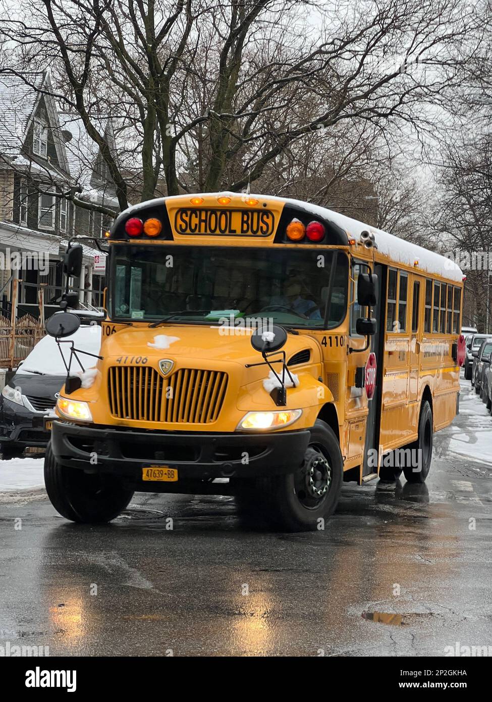 Public schools school bus picking up children on a wintery morning in ...