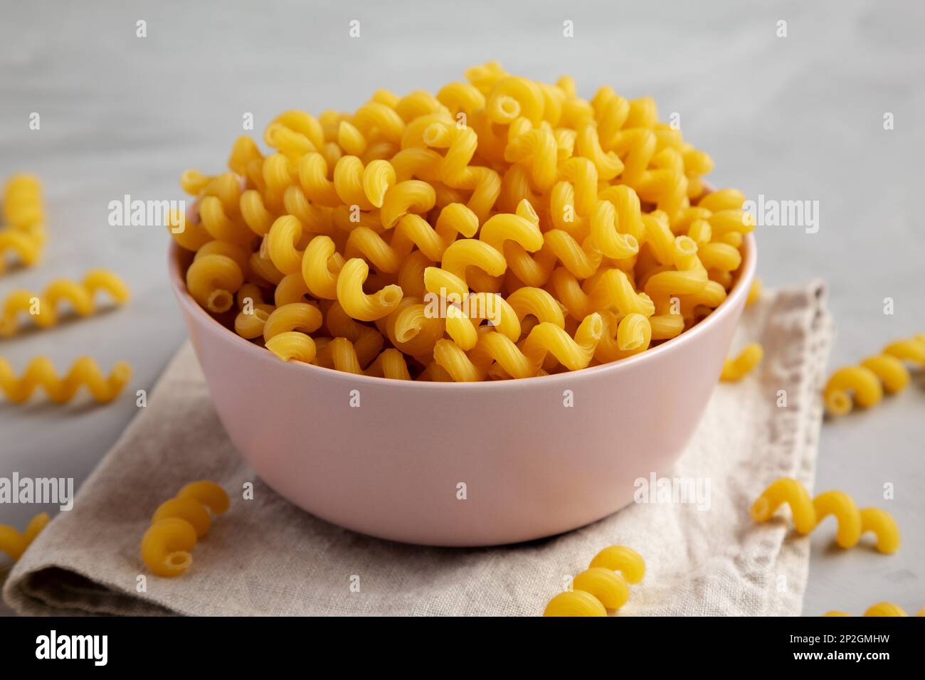 Homemade Organic Dried Riccioli Pasta in a Pink Bowl, side view Stock ...