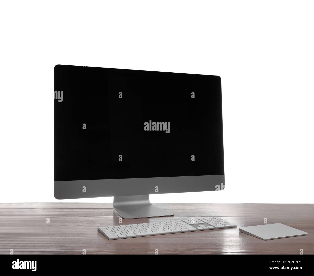 Modern computer with blank monitor screen and peripherals on wooden ...