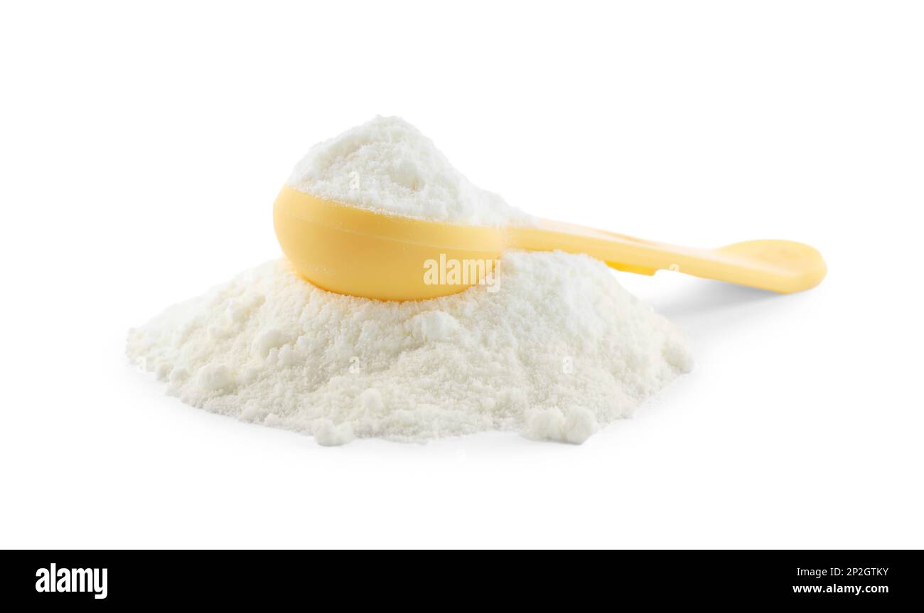 Powdered infant formula and measuring scoop on white background. Baby ...