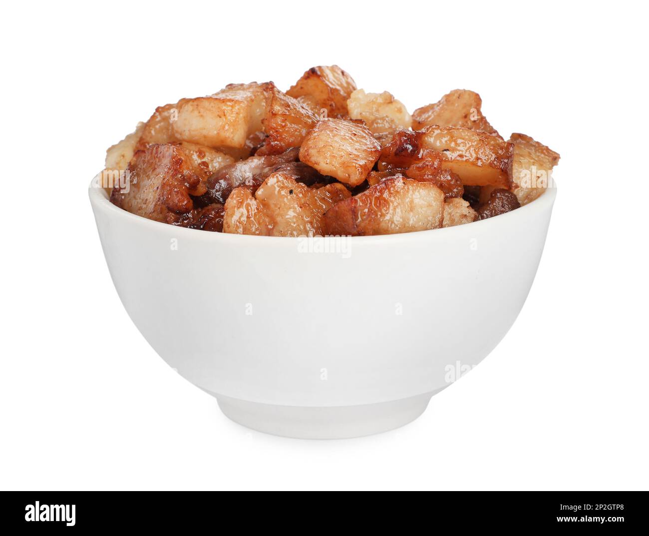 Tasty fried cracklings in bowl on white background. Cooked pork lard ...