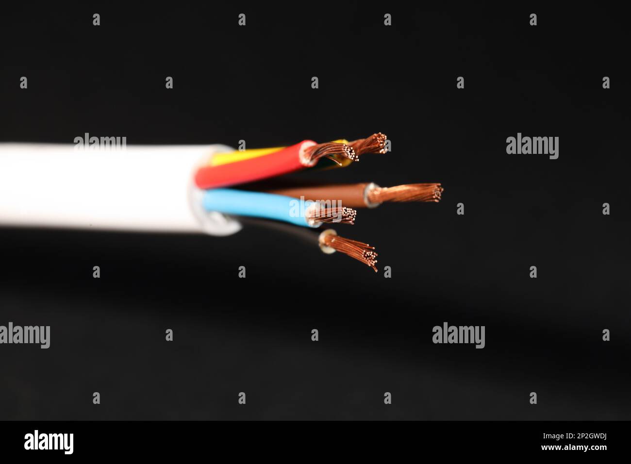 Electrical wires on black background, closeup view Stock Photo - Alamy