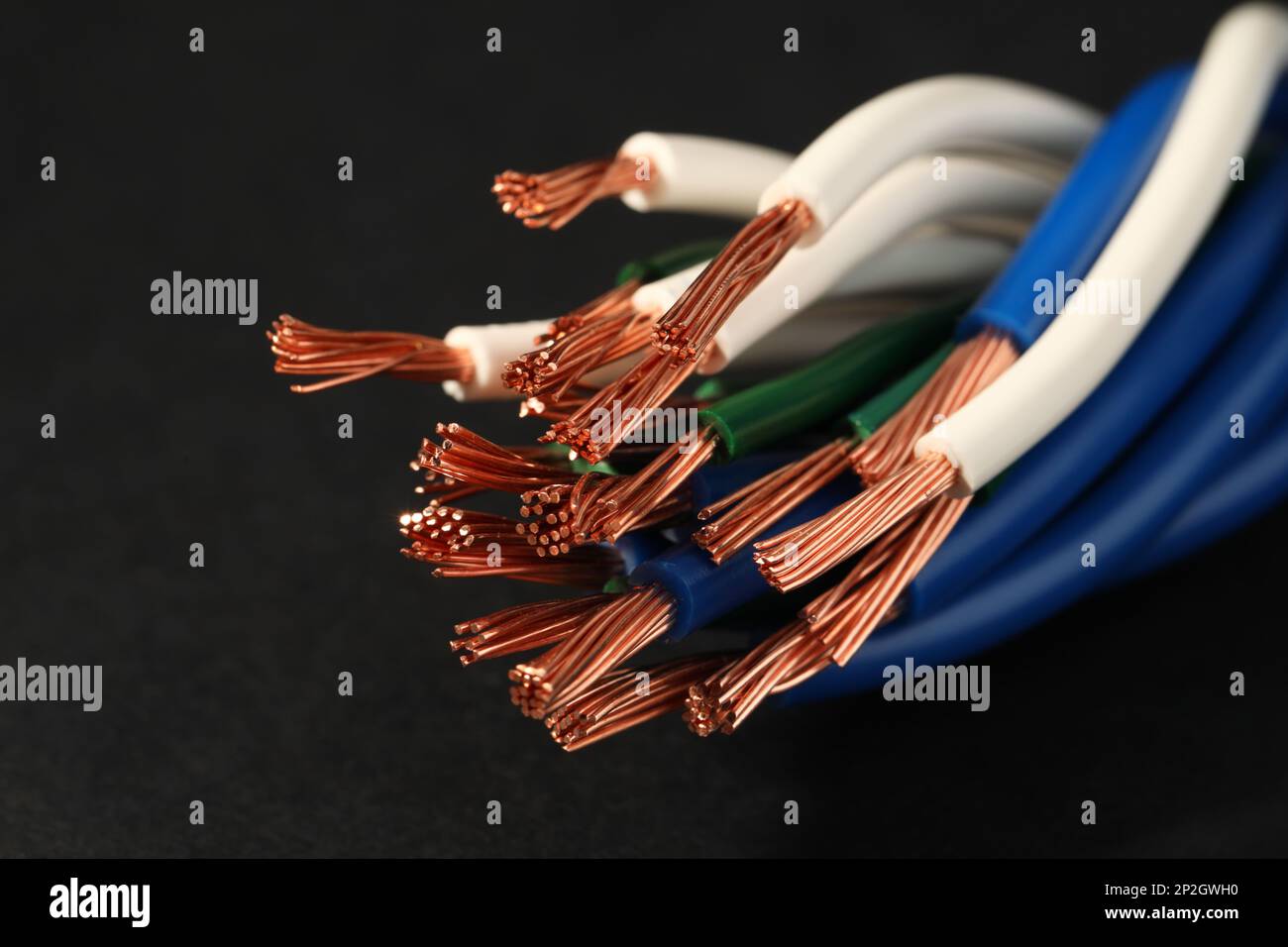 Electrical wires on black background, closeup view Stock Photo - Alamy