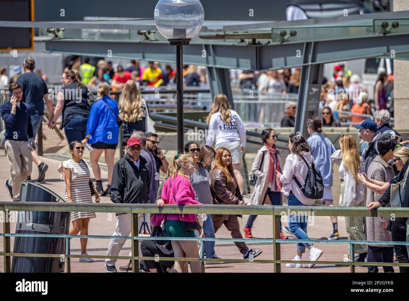 Close up of a crowd of young people walking along Circular Quay in ...