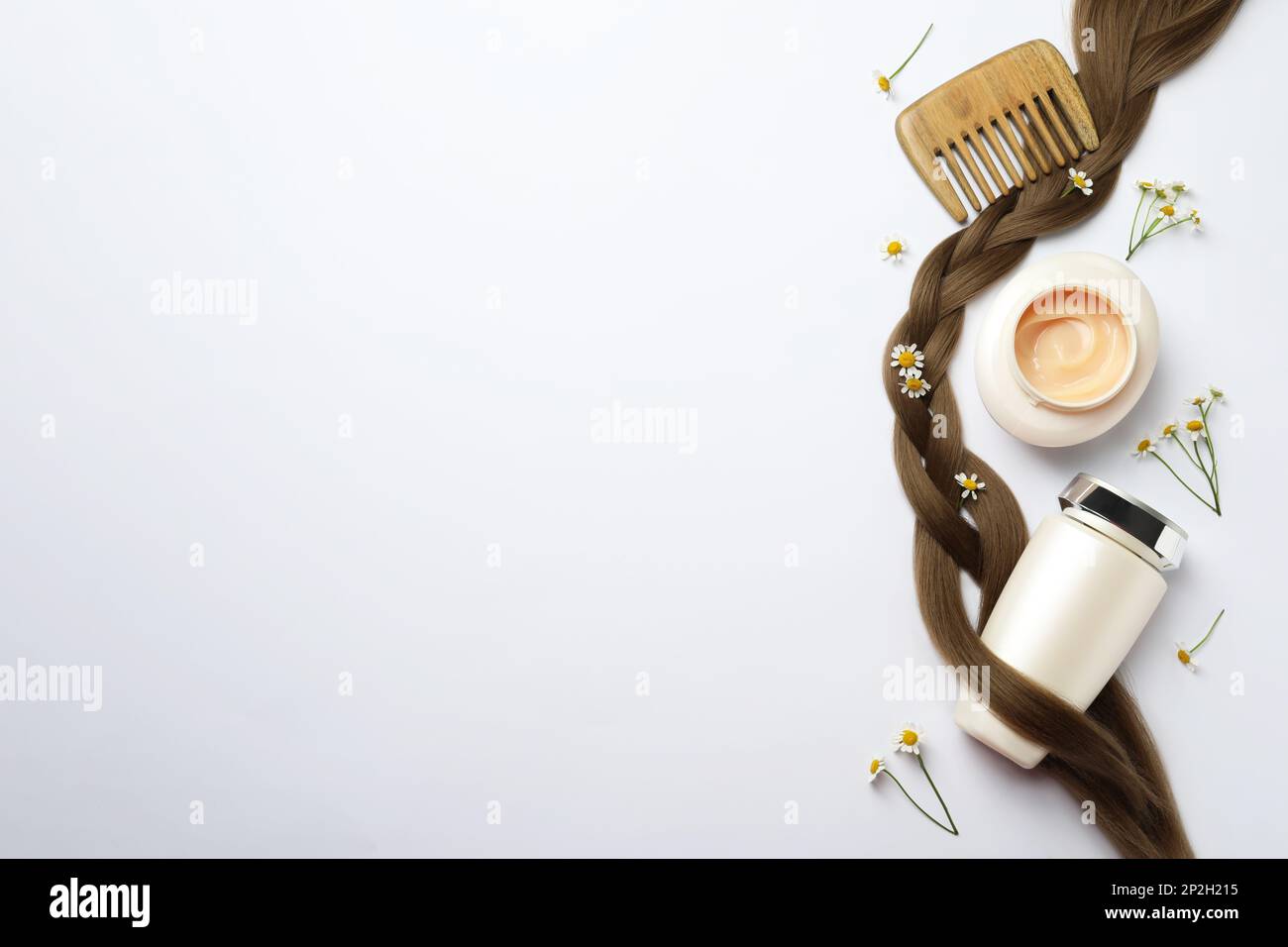 Flat lay composition with natural cosmetic products and hair braid on ...