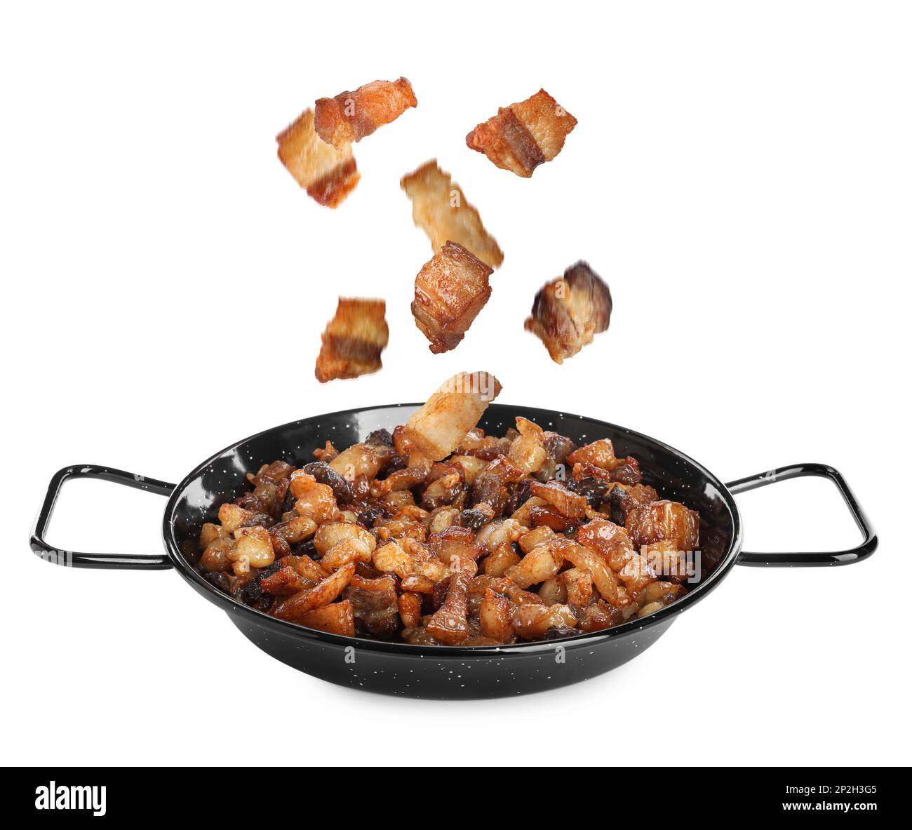 Tasty cracklings falling into frying pan on white background. Cooked ...