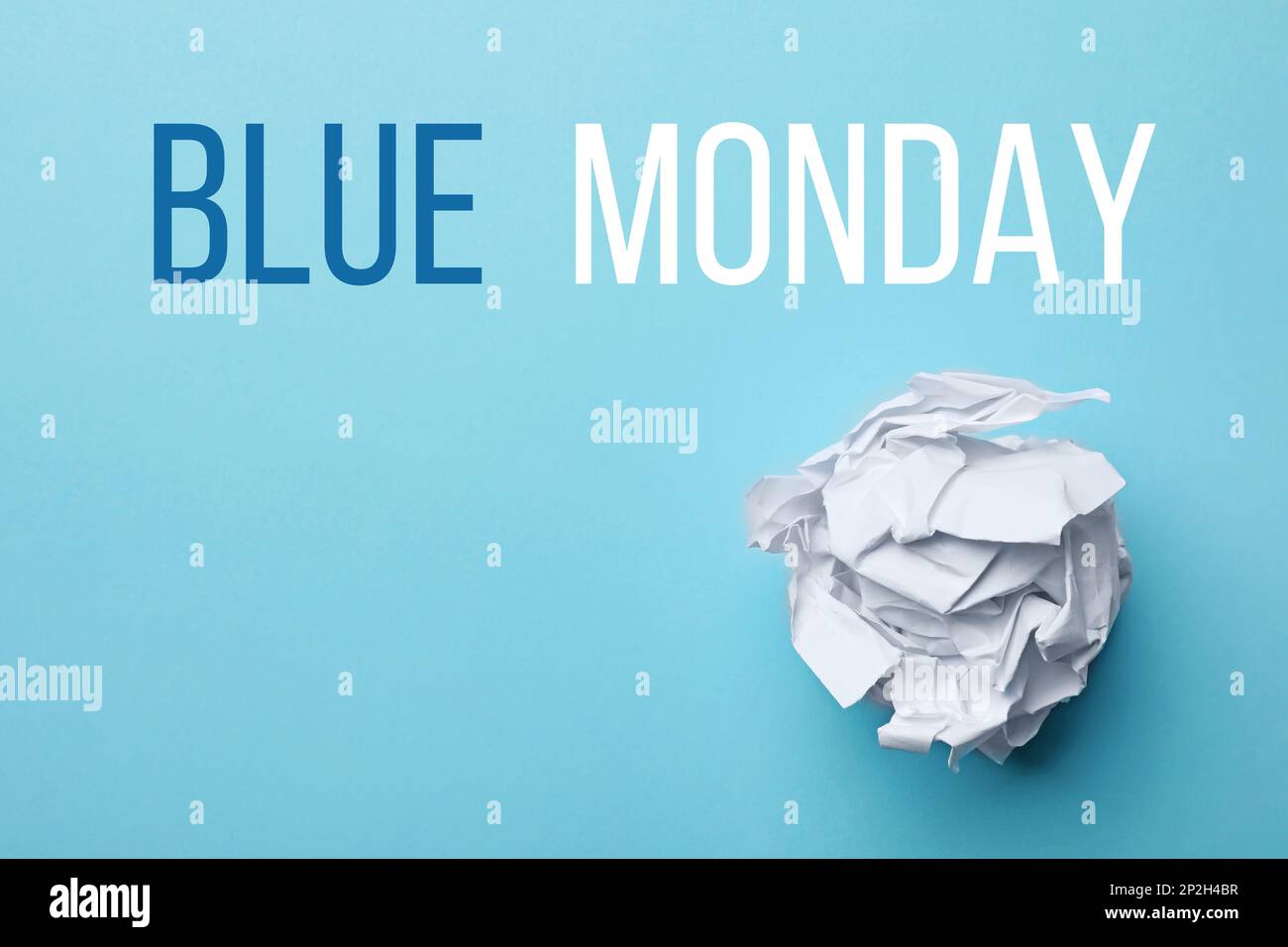 Crumpled sheet of paper and text Blue Monday on color background, top ...