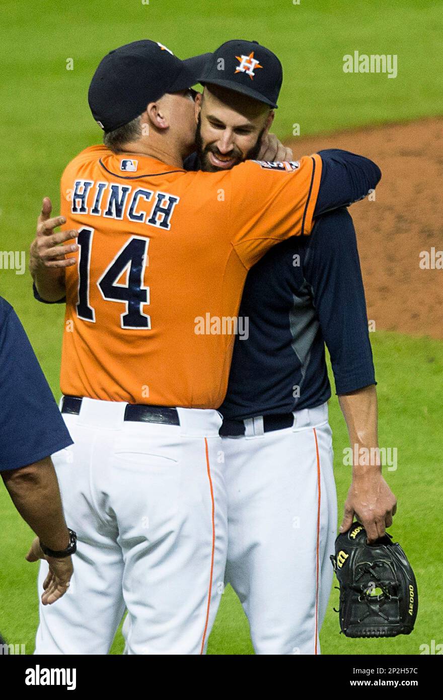 Houston Astros pitcher Mike Fiers is embraced by manager A.J. Hinch ...