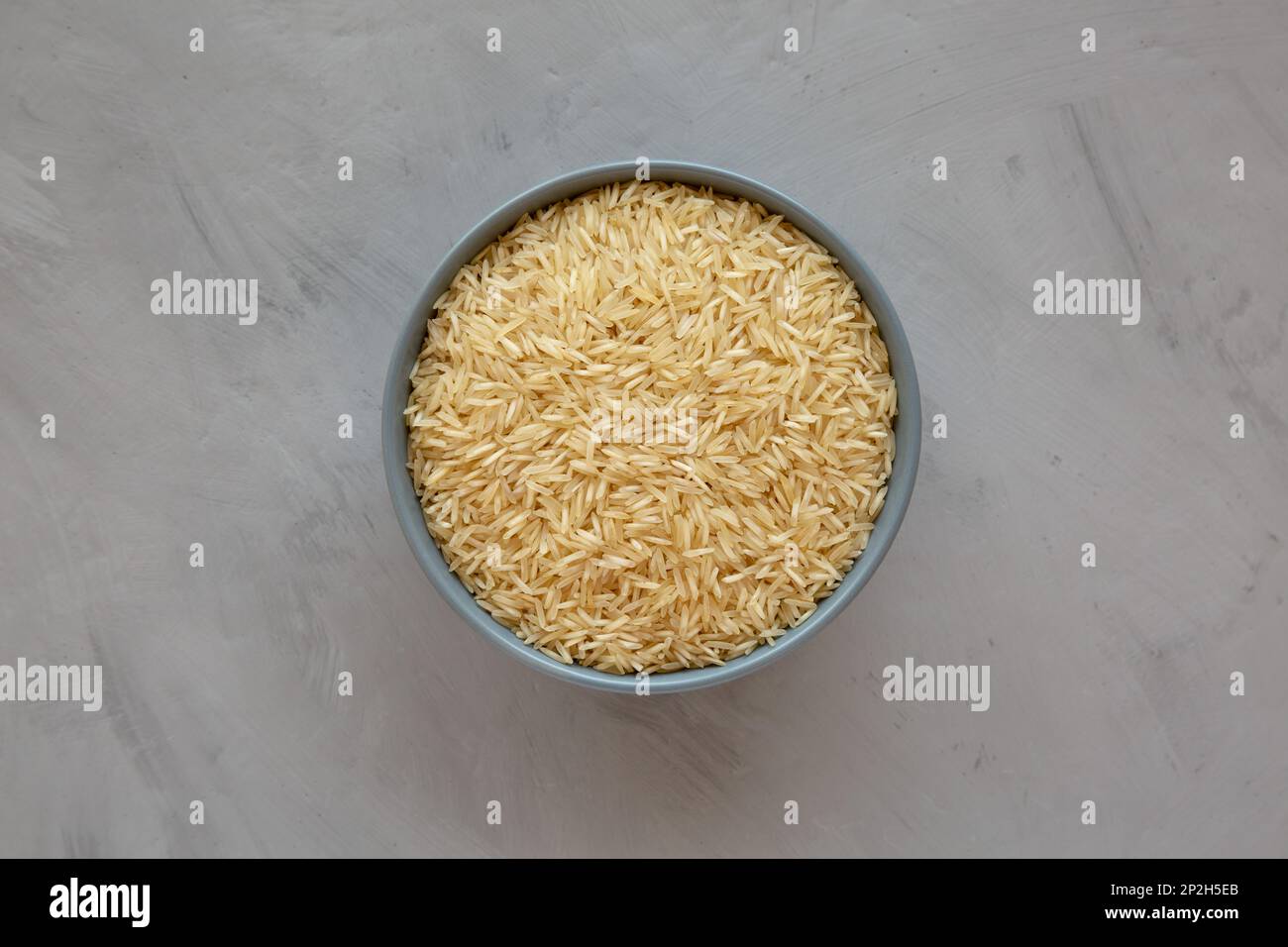 Dry Organic Indian Basmati Rice in a Bowl on a gray background, top ...
