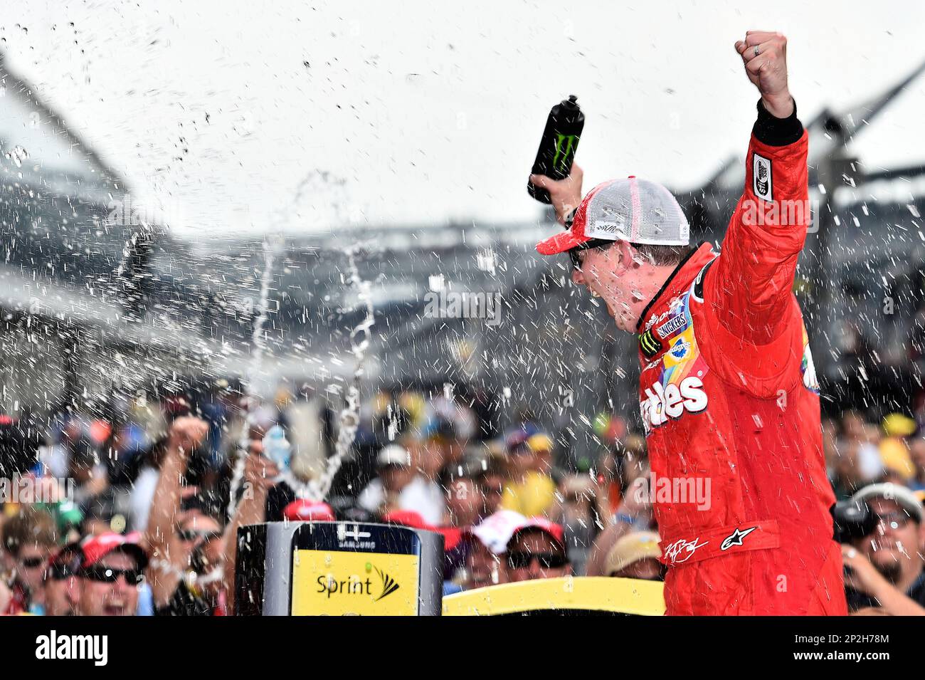 Kyle Busch, Skittles Toyota Camry (18) celebrates in victory lane after ...