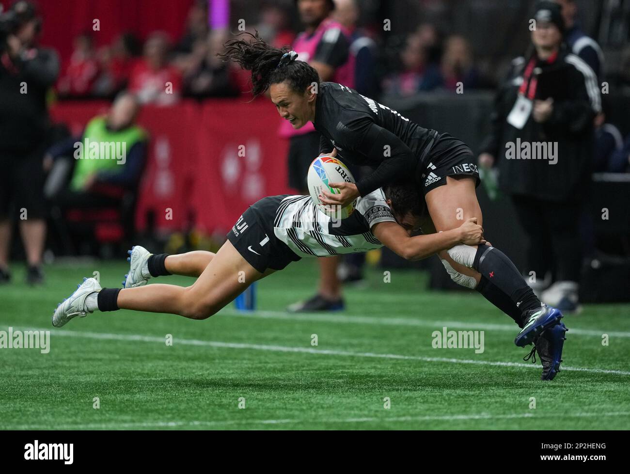 Fiji's Talei Qalo Wilson, left, tackles New Zealand's Portia Woodman ...