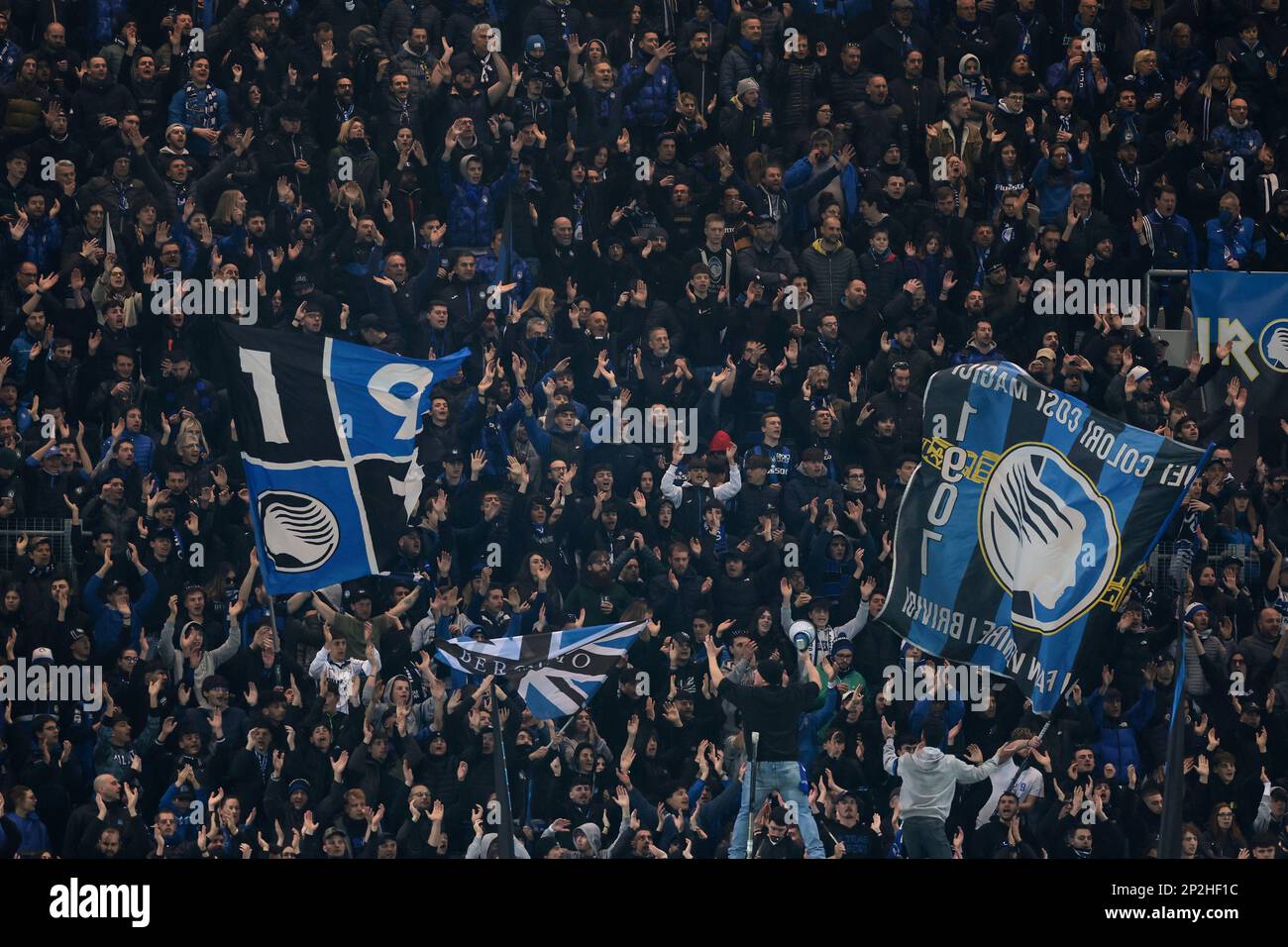 Bergamo, Italy, 4th March 2023. Atalanta fans wave flags and cheer on ...