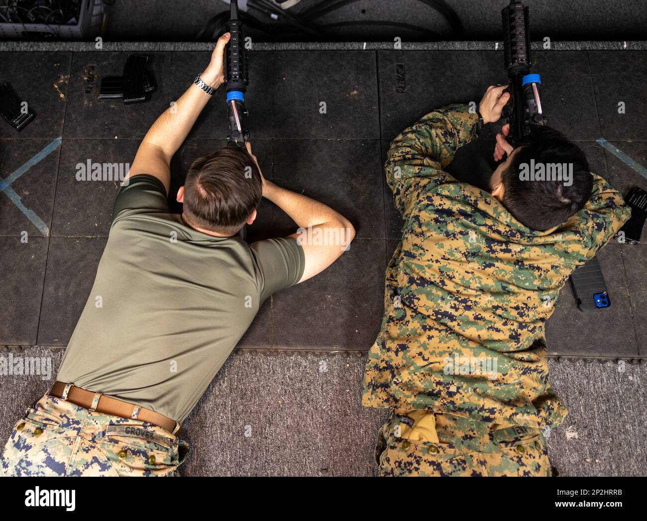 U.S. Marine Corps Sgt. William Groves, left, and Cpl. Aaron Pena, right ...