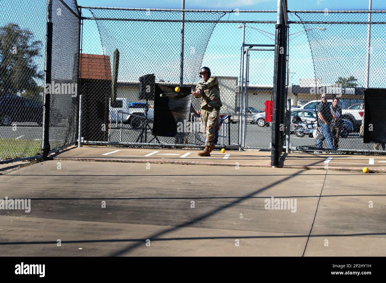 A Soldier takes a swing while using the Fort Polk batting cages after ...