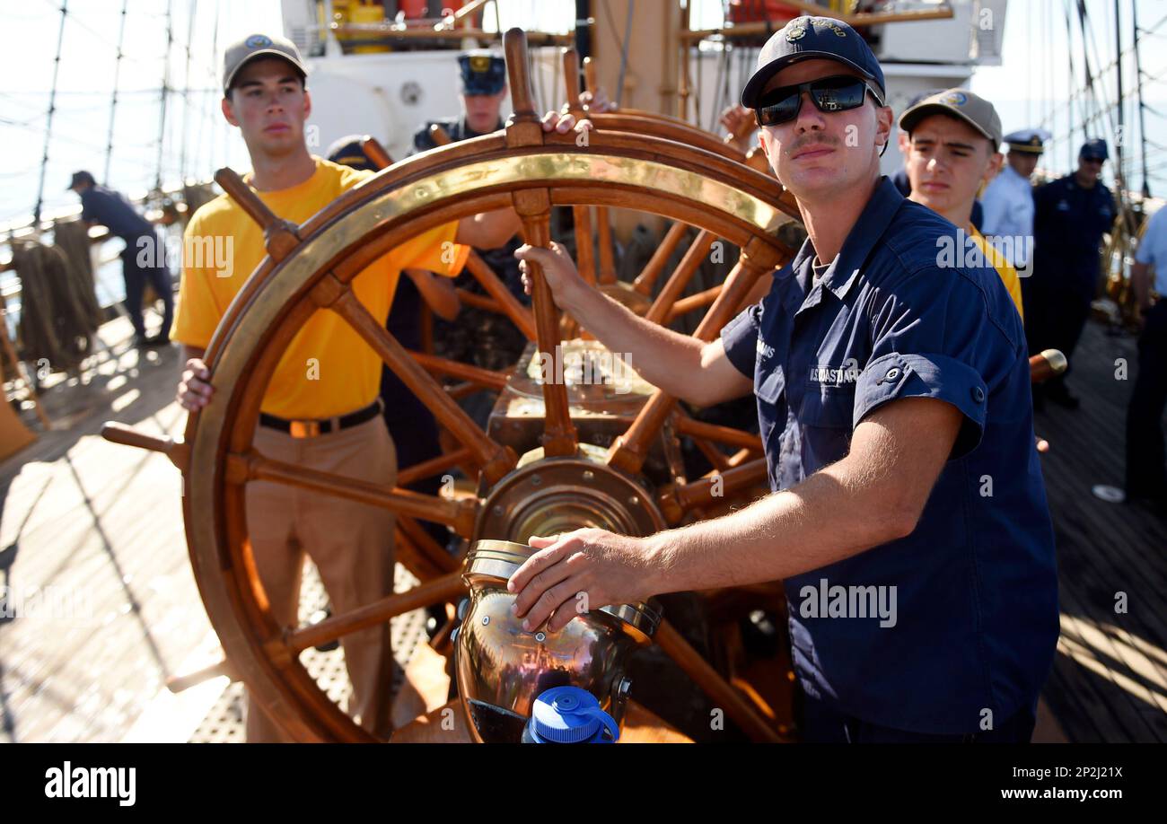Helmsman Coast Guard Seaman Devin Adams is joined by Naval Junior ROTC ...
