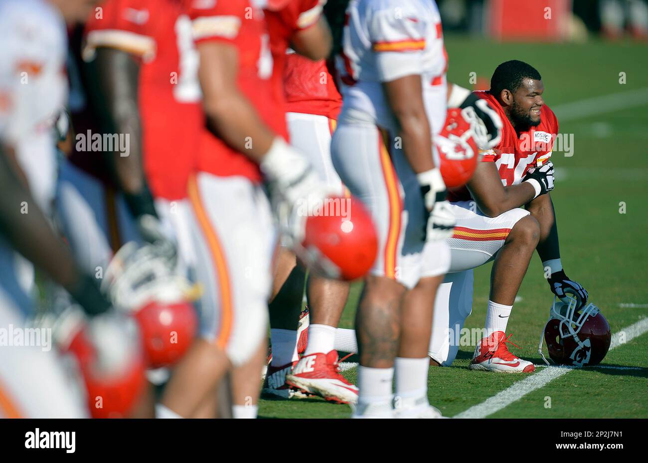 Kansas City Chiefs tackle Tavon Rooks, right, takes a knee during NFL ...