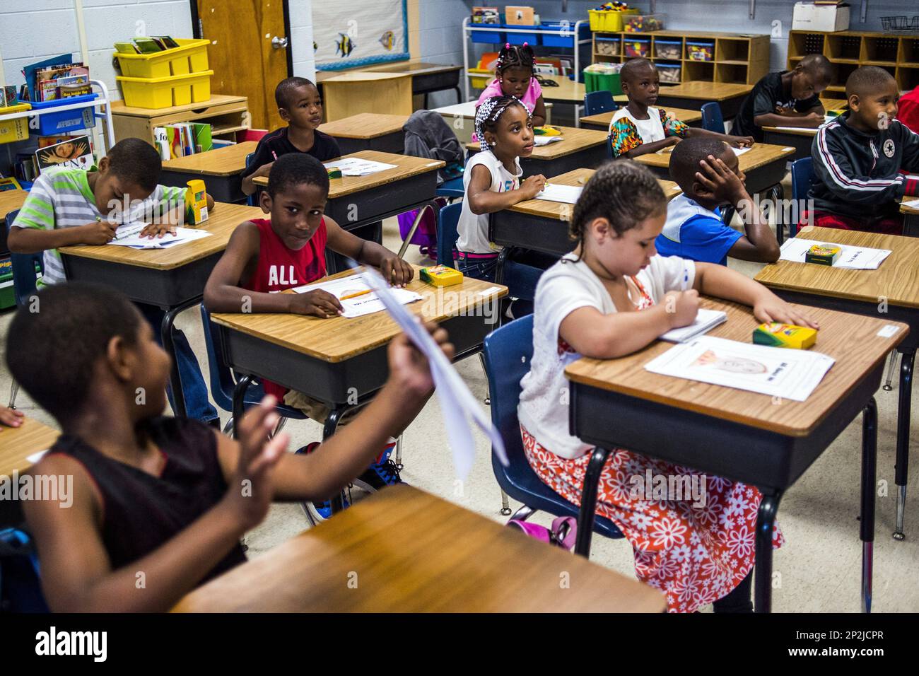 Second-graders pay attention in teacher David Bell's classroom during ...