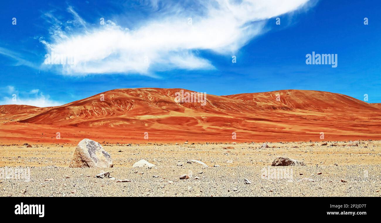 View over dry barren sand pebble desert to beautiful red orange colored ...