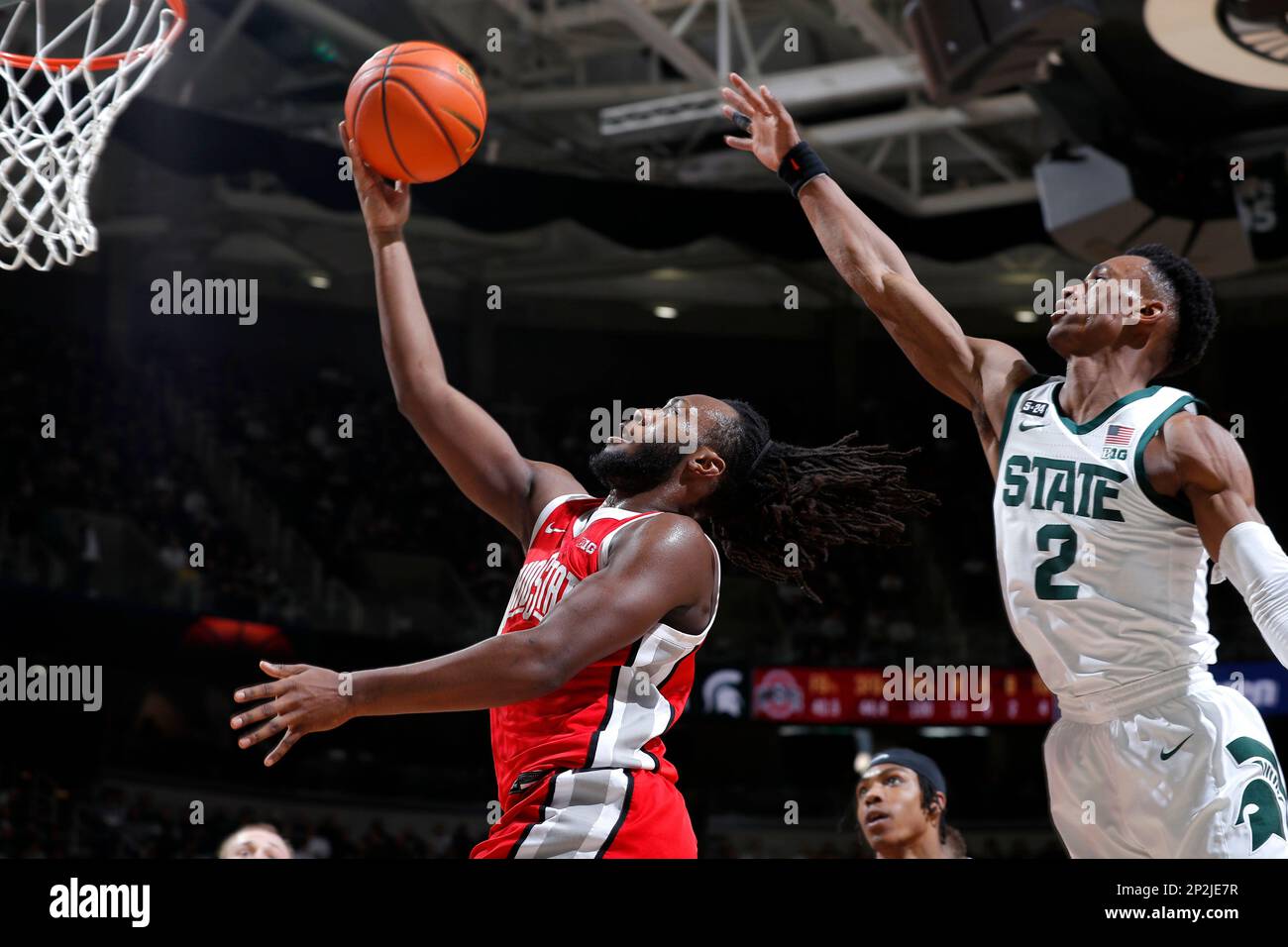 Ohio State's Bruce Thornton, left, goes to the basket against Michigan ...