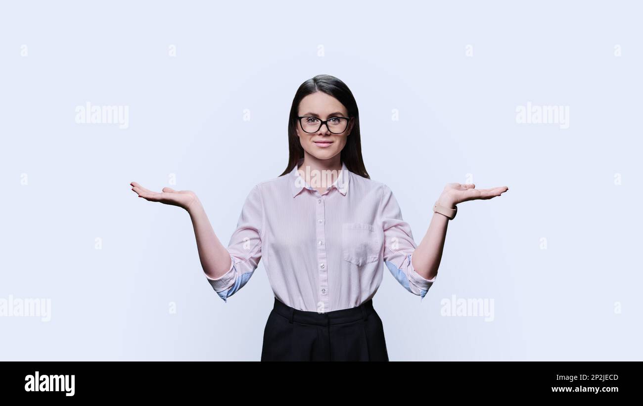 Business woman holding two hands with empty open palms on white ...