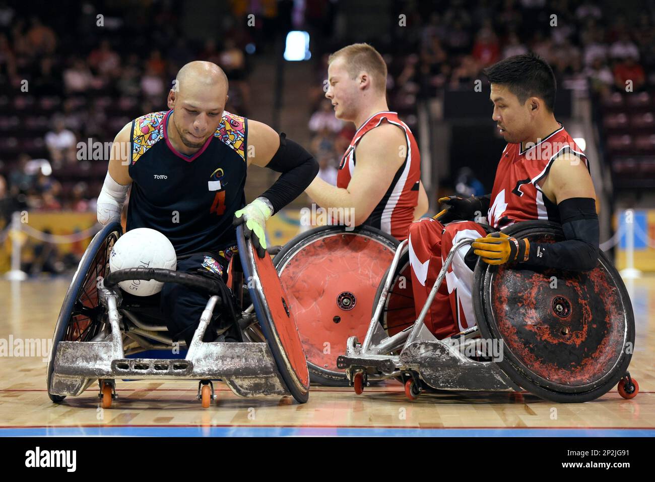 Jhon Orozco Nunez, left, of Colombia, scores as Canadians Zak Madell ...