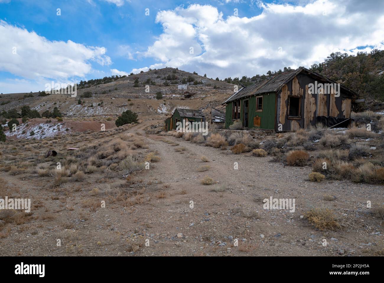 Shacks in ruins along a dirt road at an abandoned mine, Nevada, USA ...