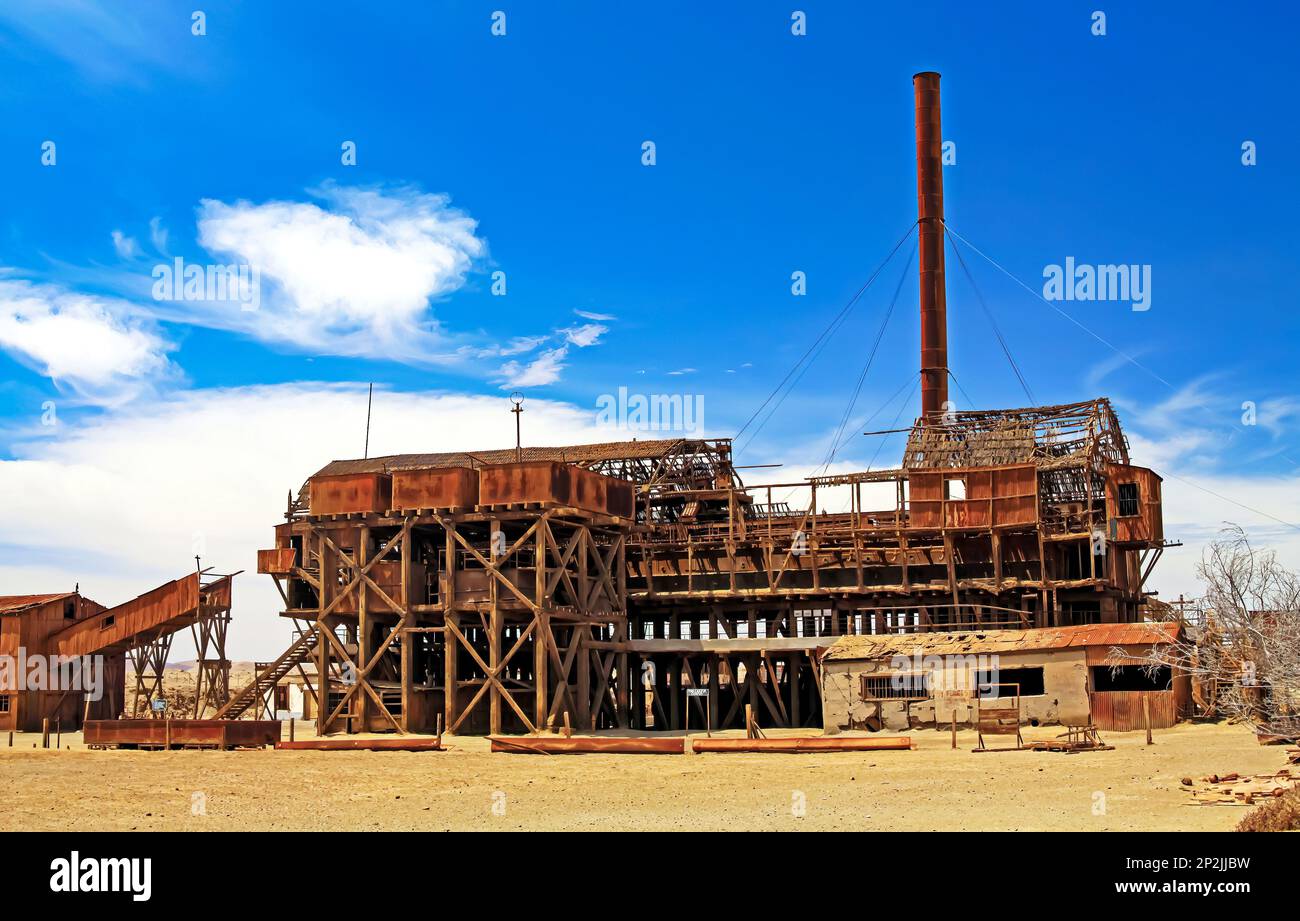 Abandoned old industrial plant with chimney in salpeter mining village ...