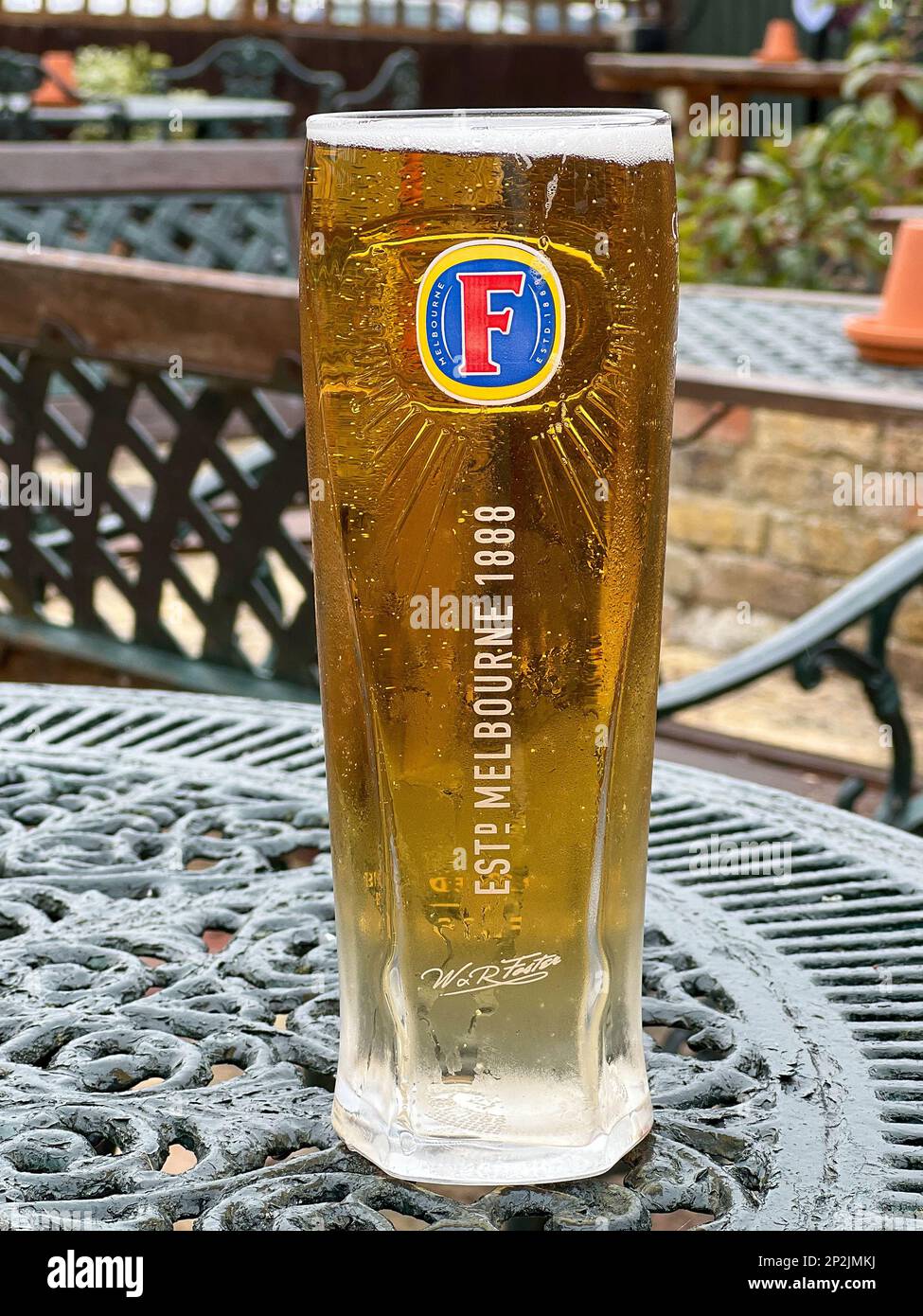 Folkestone, England - August 16, 2022: A pint of ice cold Fosters lager ...