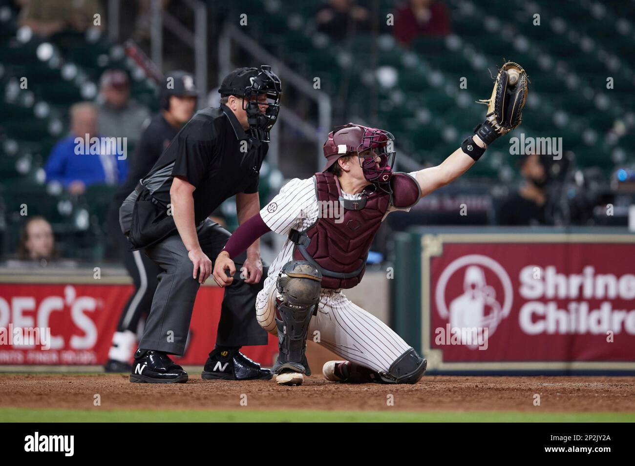 Texas A&M Aggies catcher Hank Bard (48) reaches for a high pitch as ...