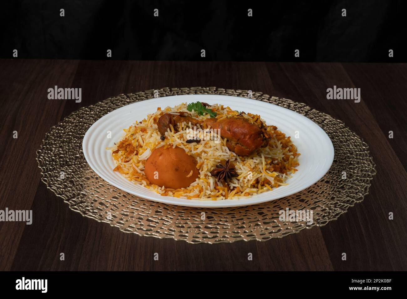 Chicken Biryani with sauces, popular Pakistani Indian food in a white ...