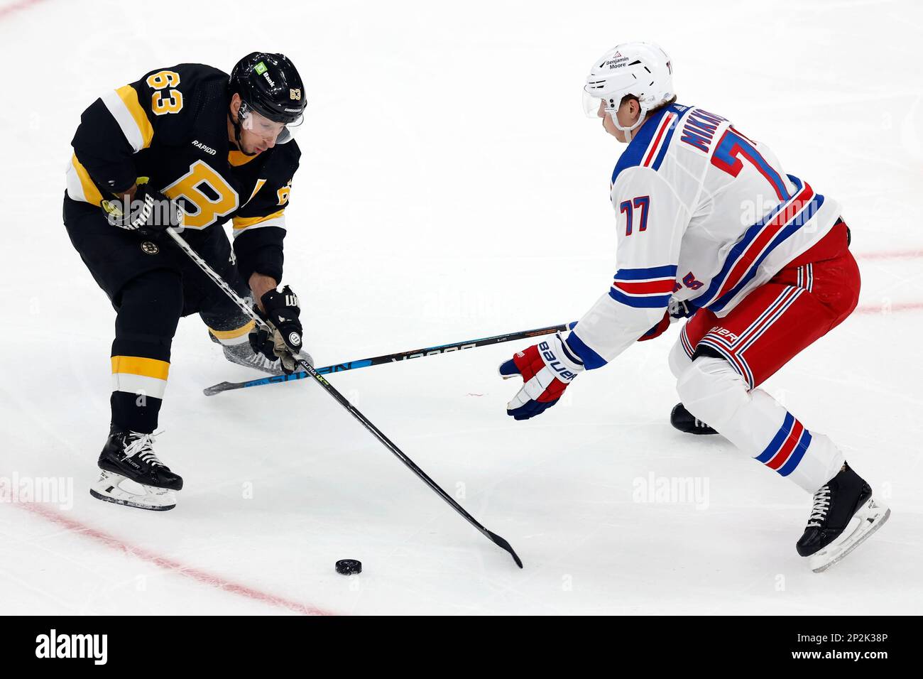 New York Rangers' Niko Mikkola (77) defends against Boston Bruins' Brad ...