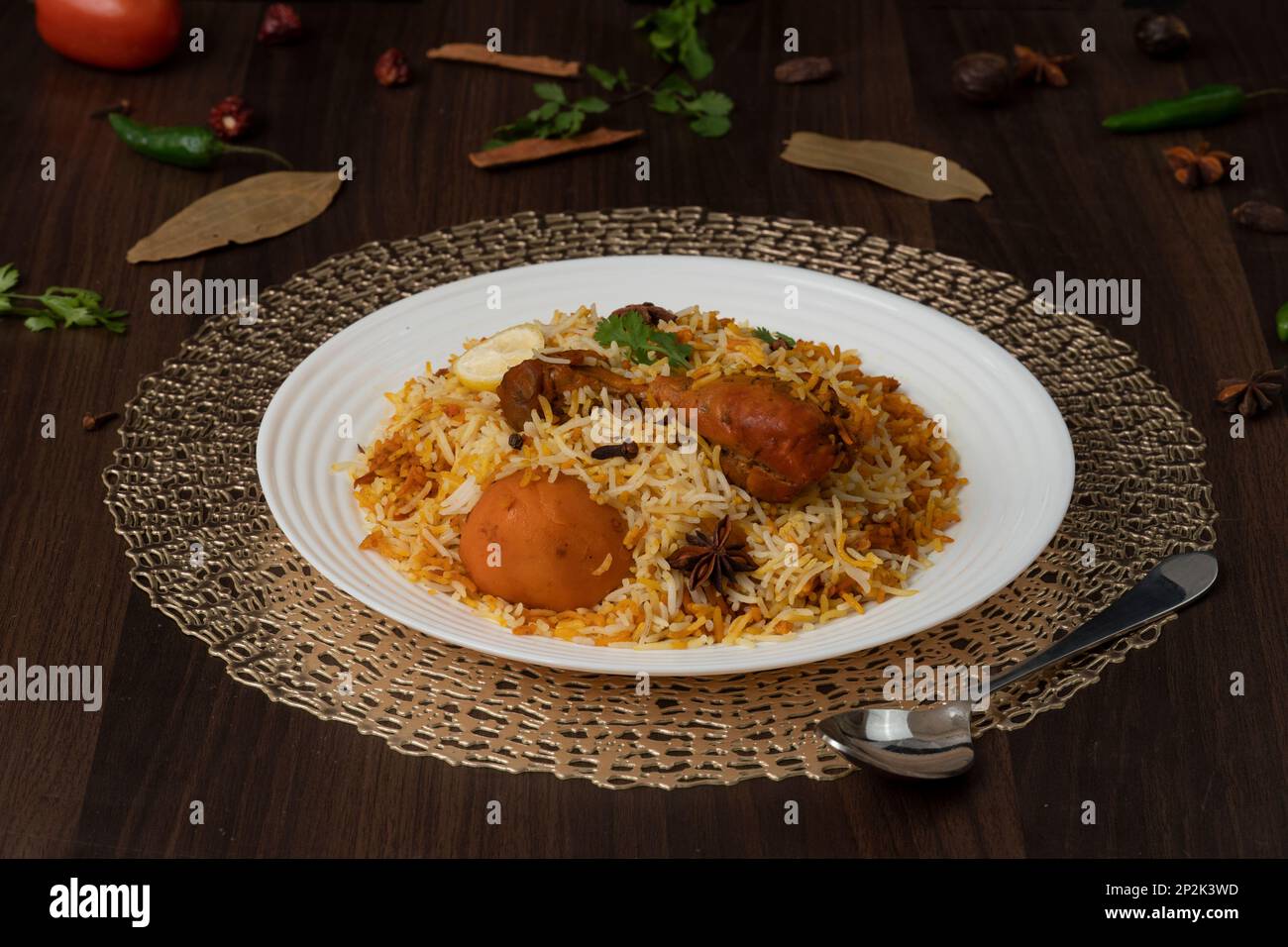Chicken Biryani with sauces, popular Pakistani Indian food in a white ...