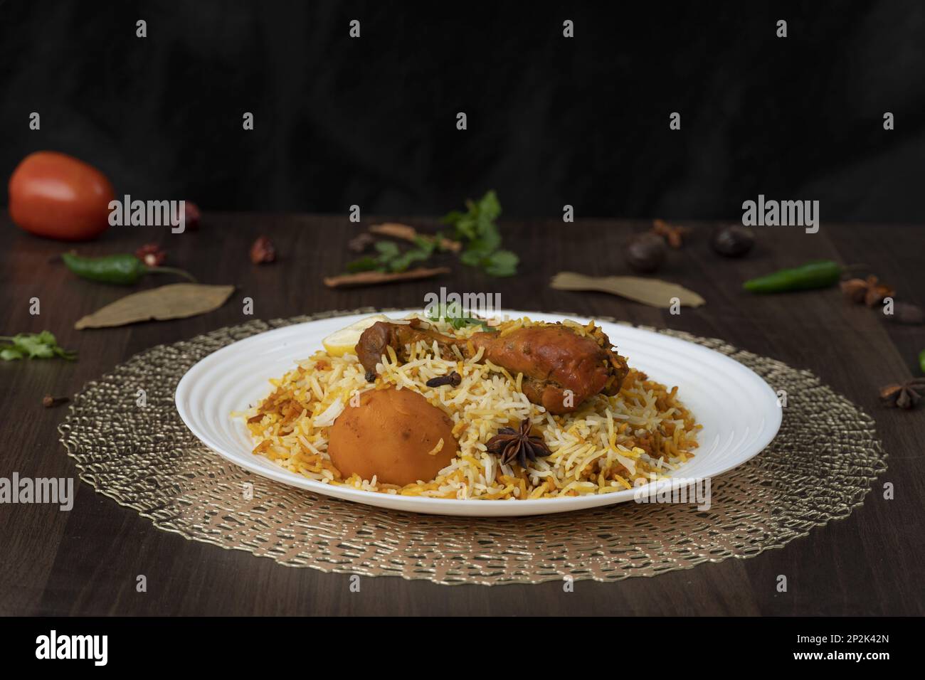Chicken Biryani with sauces, popular Pakistani Indian food in a white ...