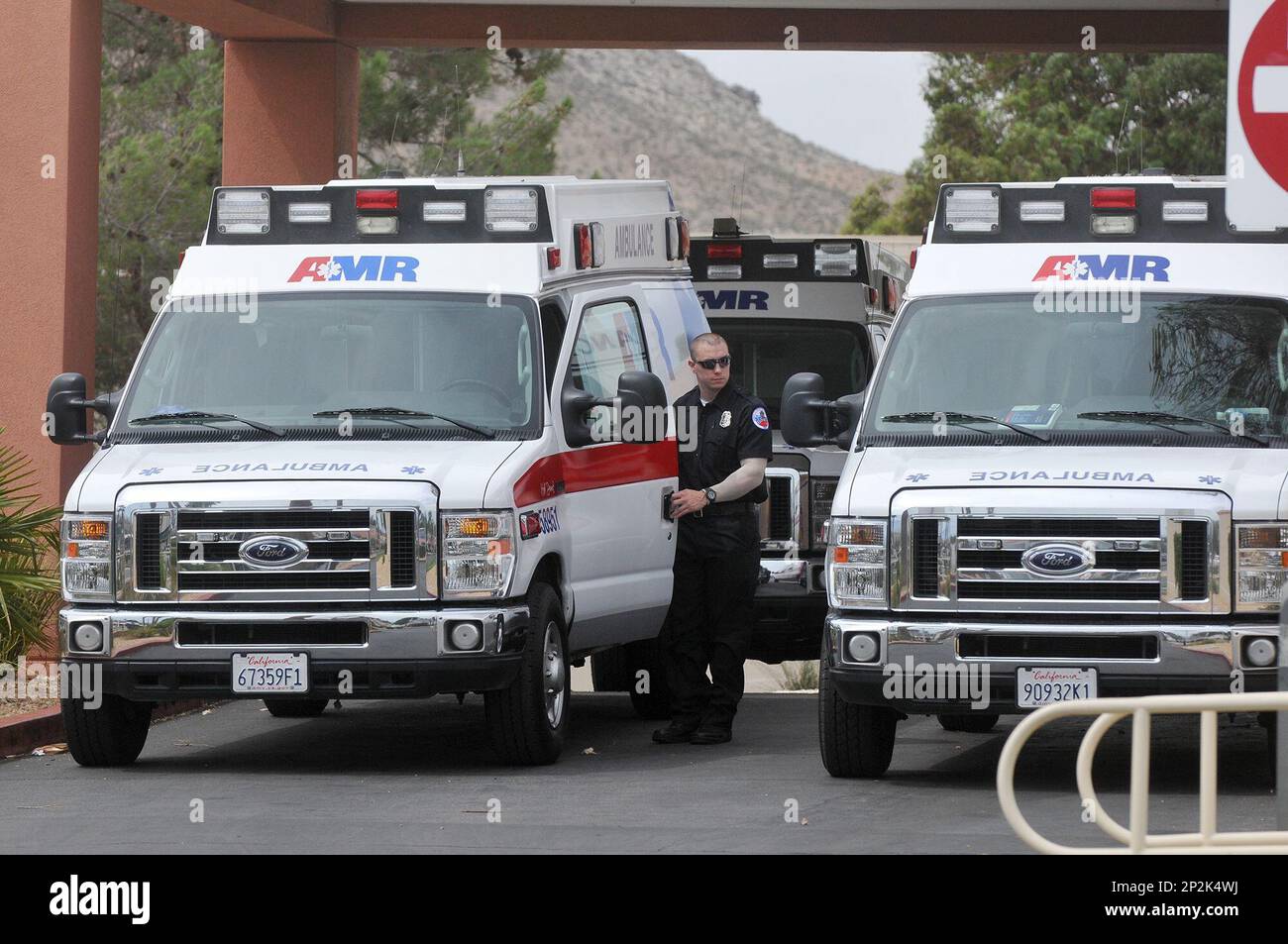 Three American Medical Response ambulances are parked at the ambulance entrance at St. Joseph ...