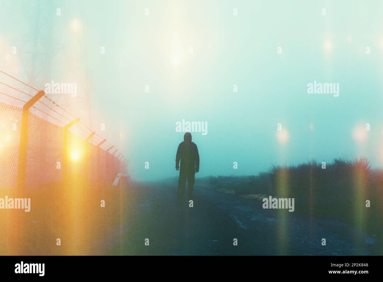 A science fiction concept of a mysterious hooded figure. Silhouetted ...