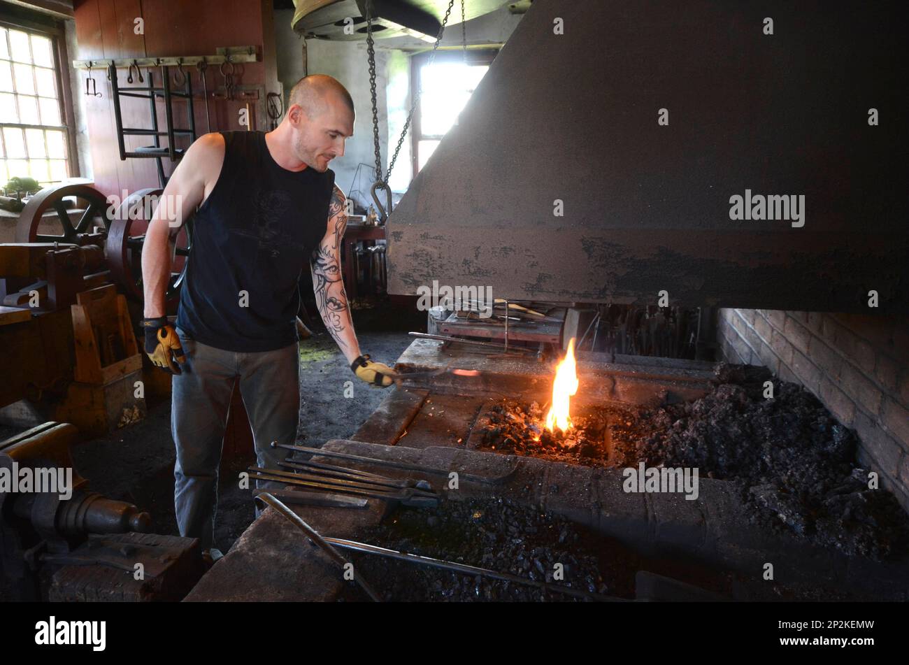 Metalworker Patrick O'Donnell fabricates a metal fork at Hancock Shaker ...