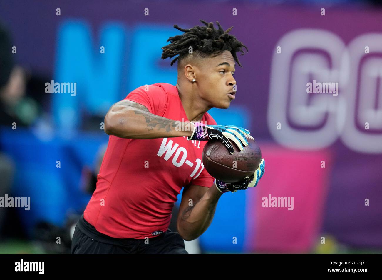Houston wide receiver Tank Dell runs a drill at the NFL football ...
