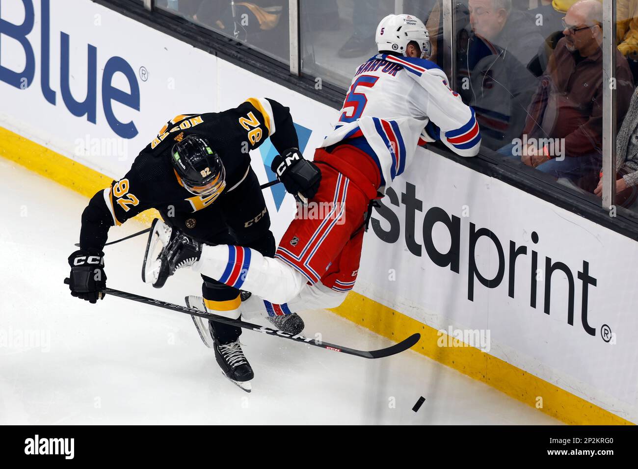 Boston Bruins' Tomas Nosek (92) checks New York Rangers' Ben Harpur (5 ...