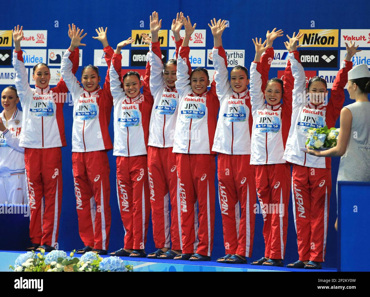 Japanese team swimmers celebrate after winning the bronze medal during ...
