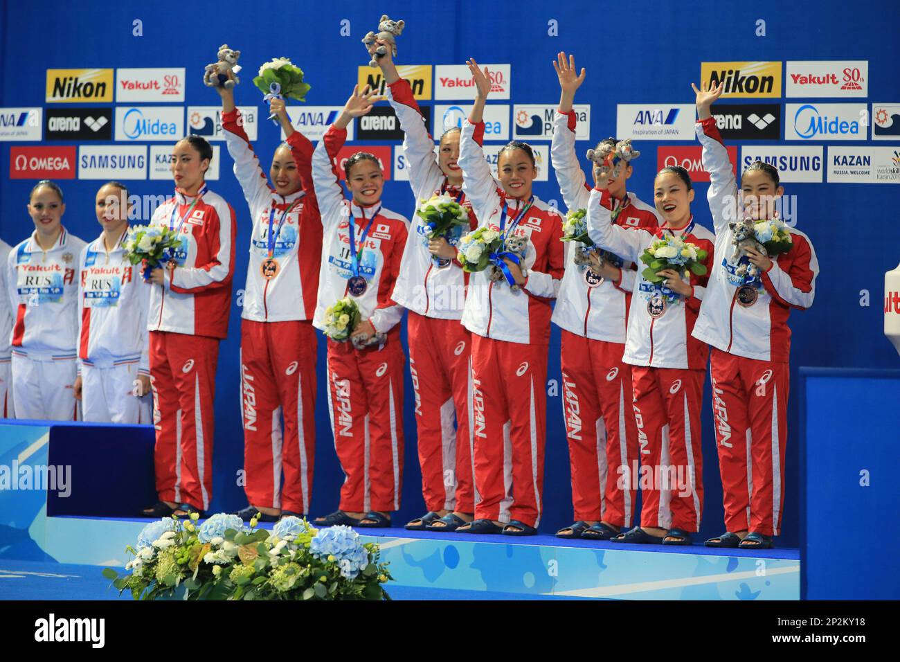 Japanese team swimmers celebrate after winning the bronze medal during ...
