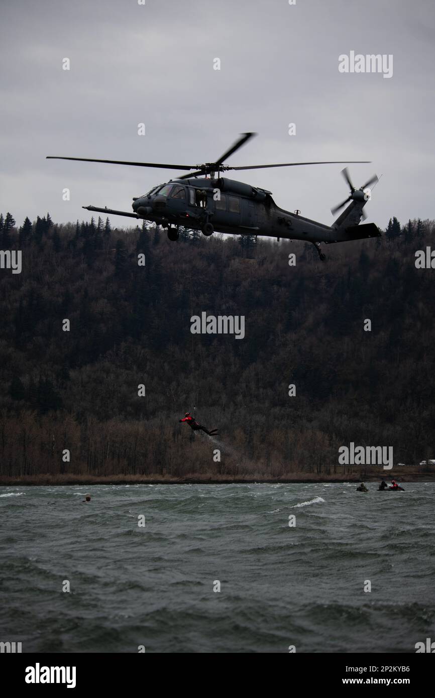 A 304th Rescue Squadron pararescueman is lifted out of the Columbia ...