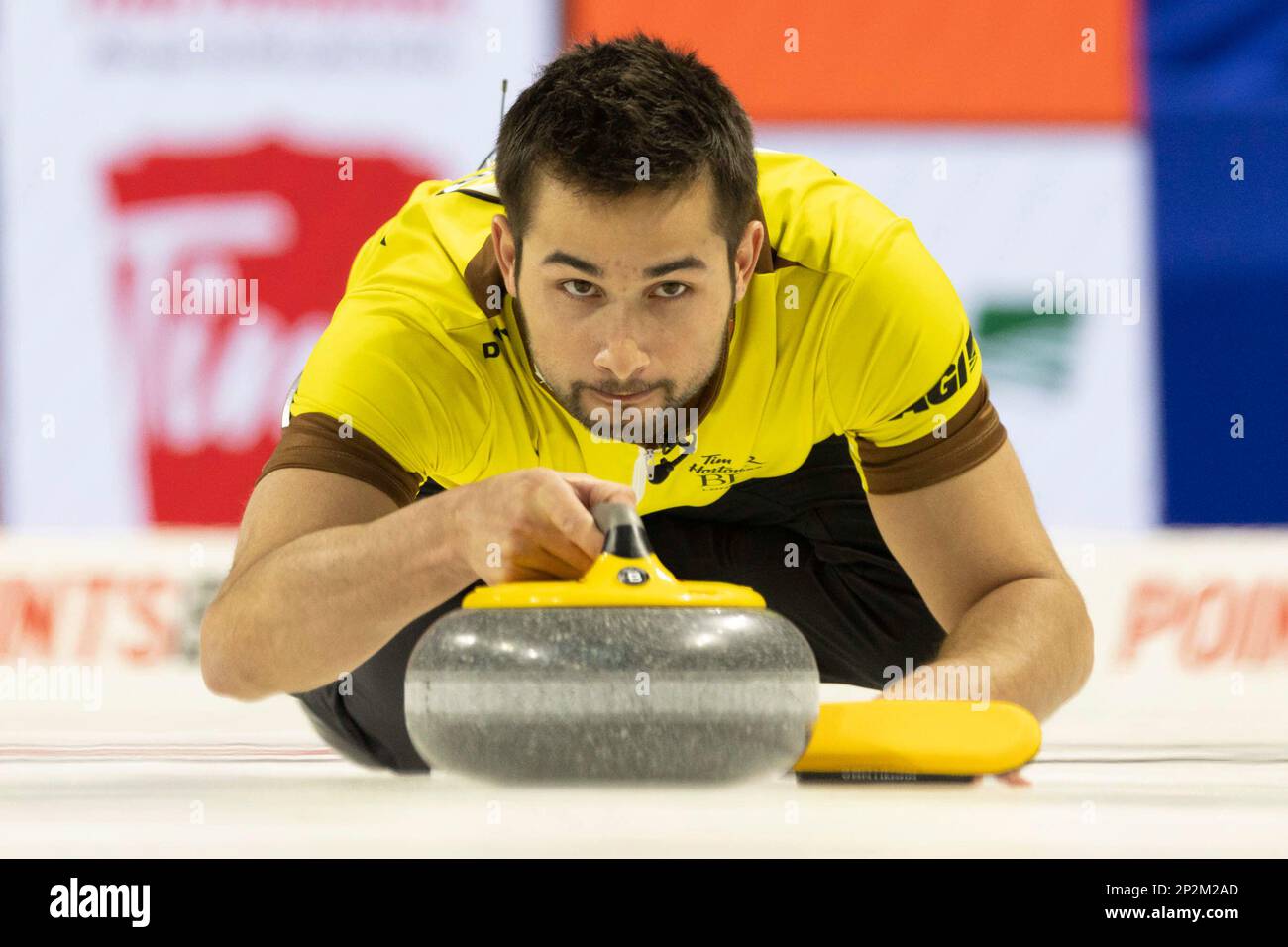 Team Manitoba second, Colton Lott makes a shot verses Team Saskatchewan during the Tim Hortons ...