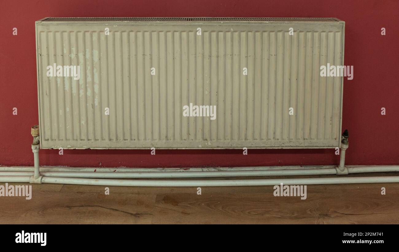 Old, worn-out radiator core with red background Stock Photo - Alamy