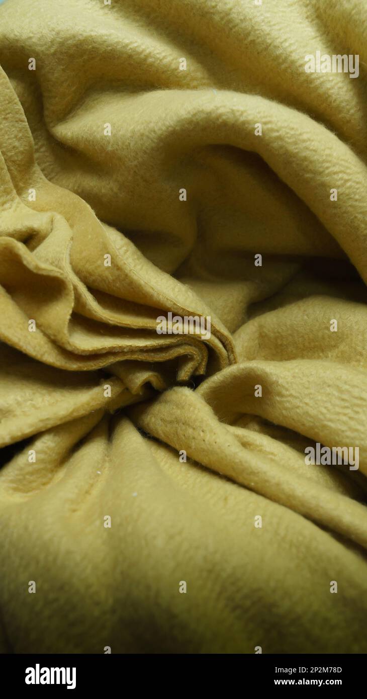Folded fabric, thick and beige colour Stock Photo - Alamy