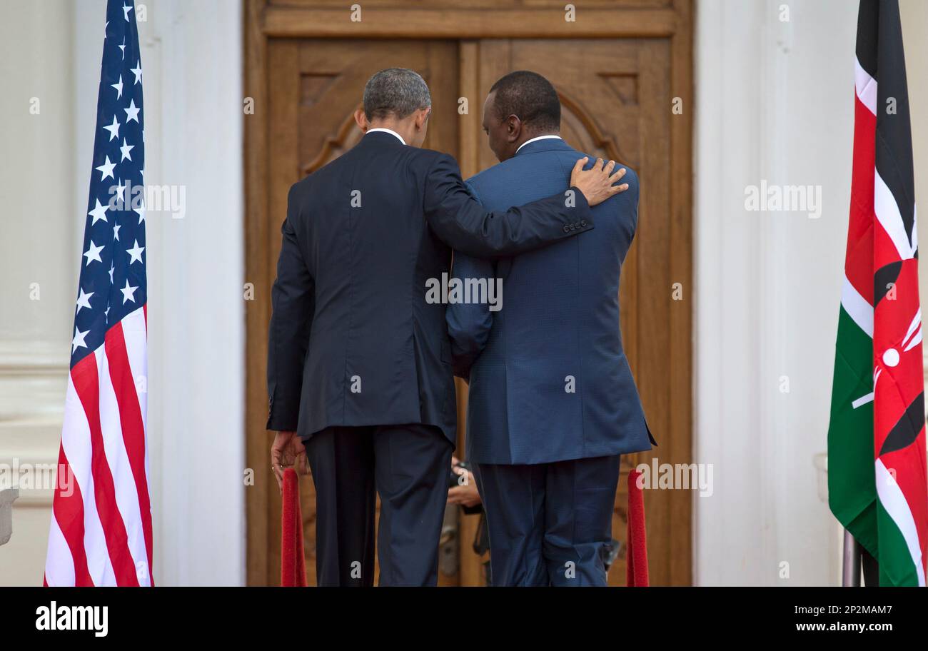 President Barack Obama, left, puts his arm on the shoulder of Kenya's ...