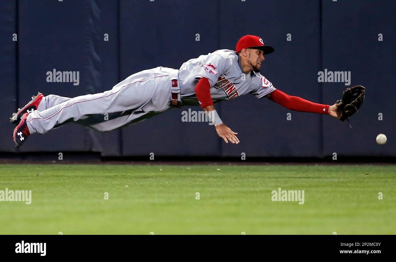 Cincinnati Reds center fielder Billy Hamilton misses the ball, allowing ...