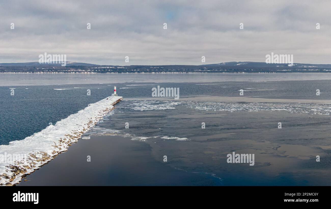 Aerial view of the breakwall in Petoskey on a sunny morning in winter ...