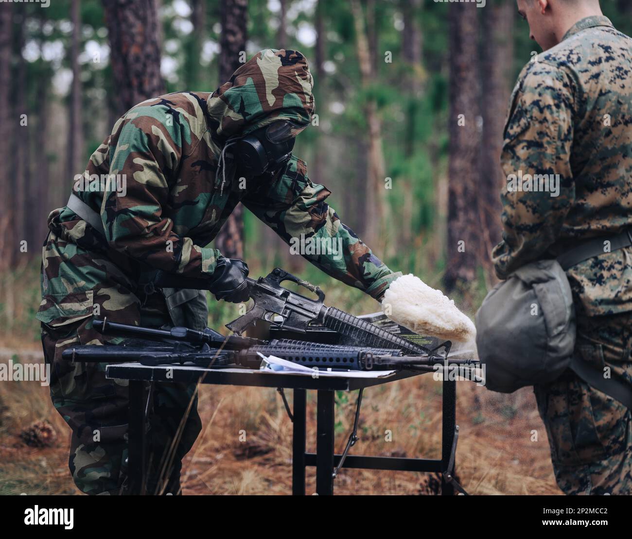 A U.S. Marine with Division Training Company, 2d Marine Division, learns how to clean a ...