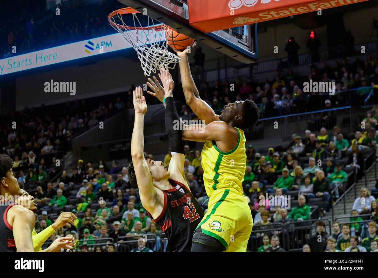 Oregon center N'Faly Dante (1) tries to lay in the ball as Stanford ...