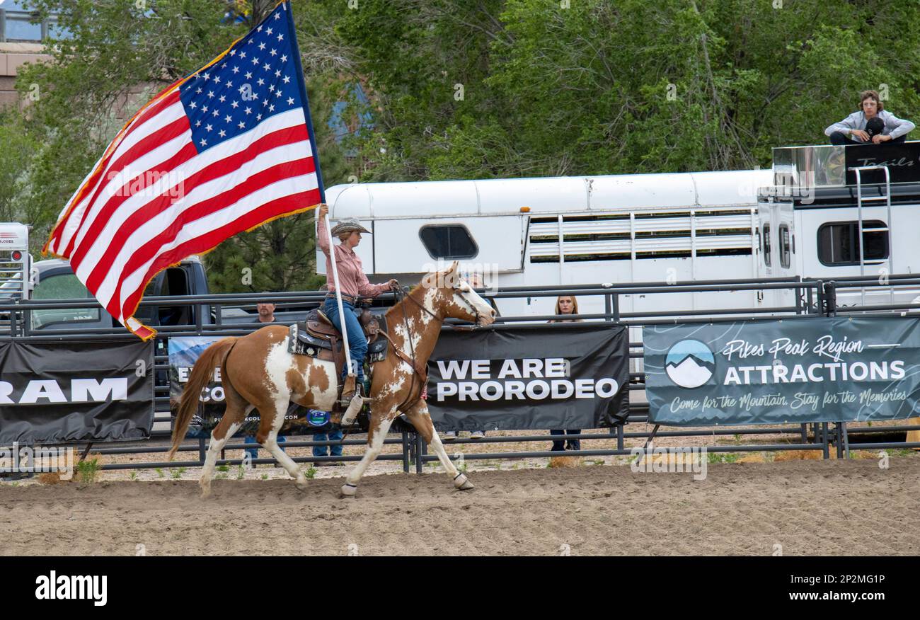 Traditional carry of American flag during opening of rodeo in Colorado ...